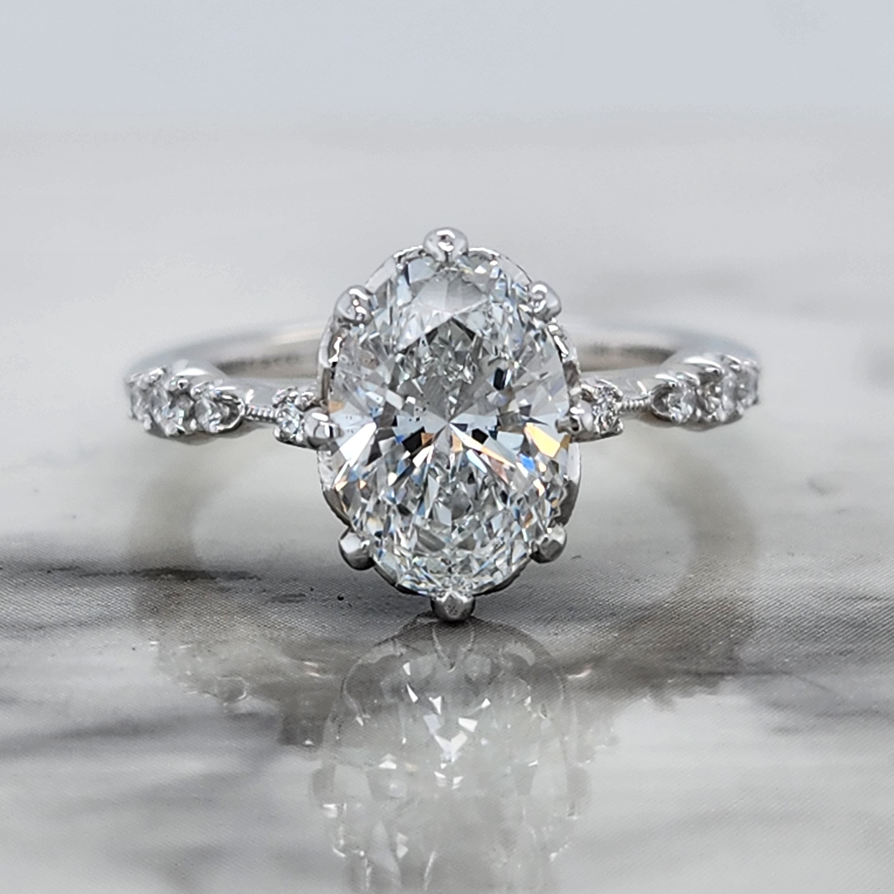 White Gold Oval Diamond Engagement Ring With Round Diamond Accents ...